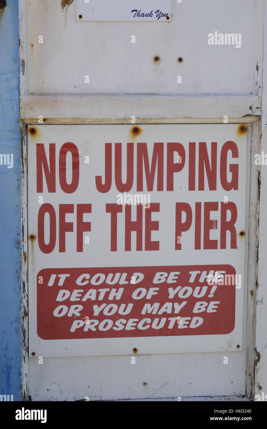 Warning sign on Eastbourne Pier Stock Photo - Alamy