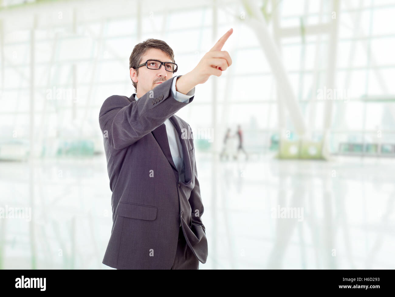 young business man pointing, at the office Stock Photo - Alamy