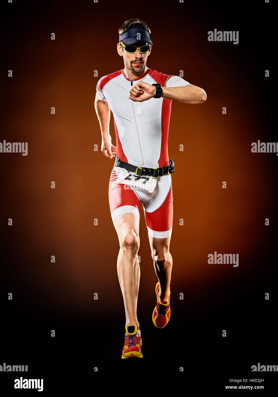 one caucasian man runner running triathlon ironman isolated Stock Photo ...