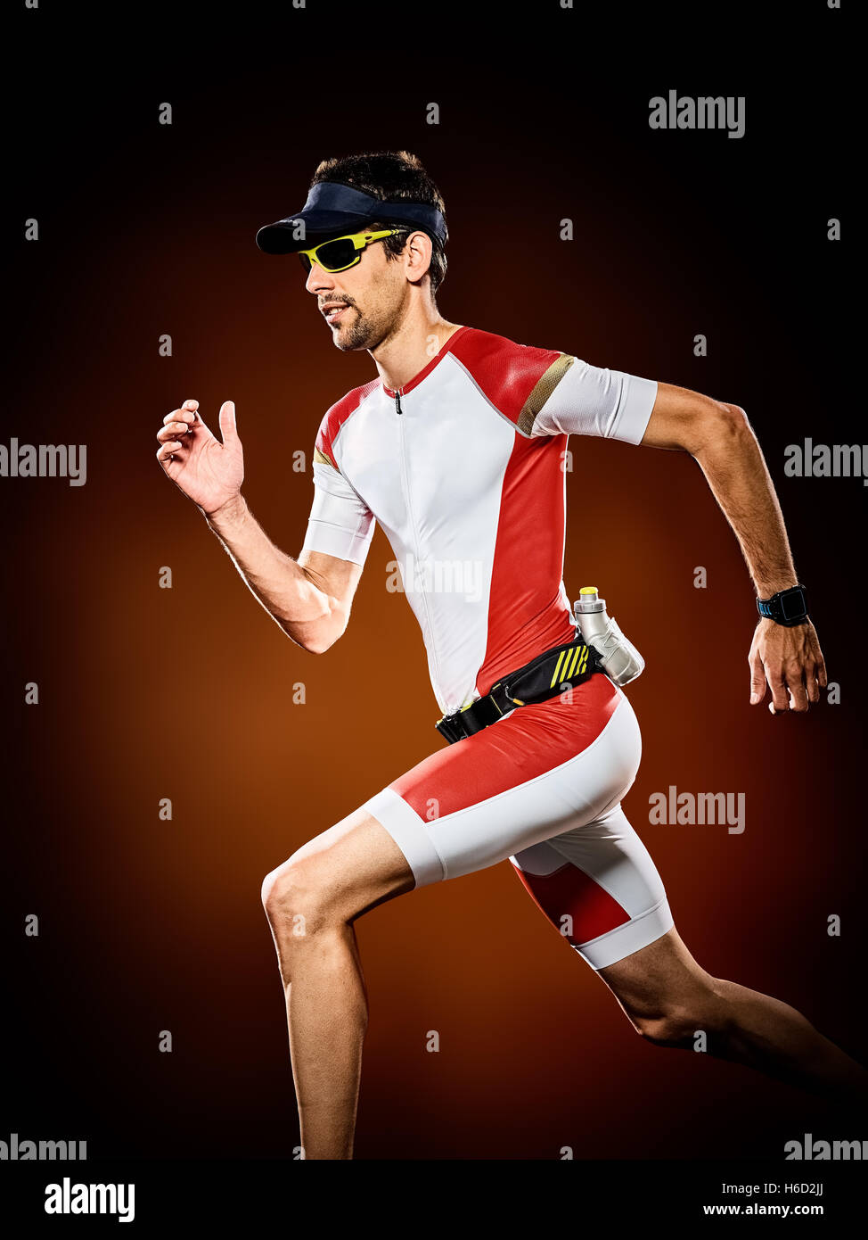 one caucasian man runner running triathlon ironman isolated Stock Photo ...