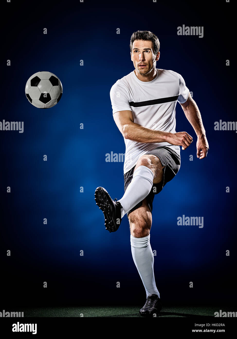 one caucasian soccer player man isolated on black background Stock ...