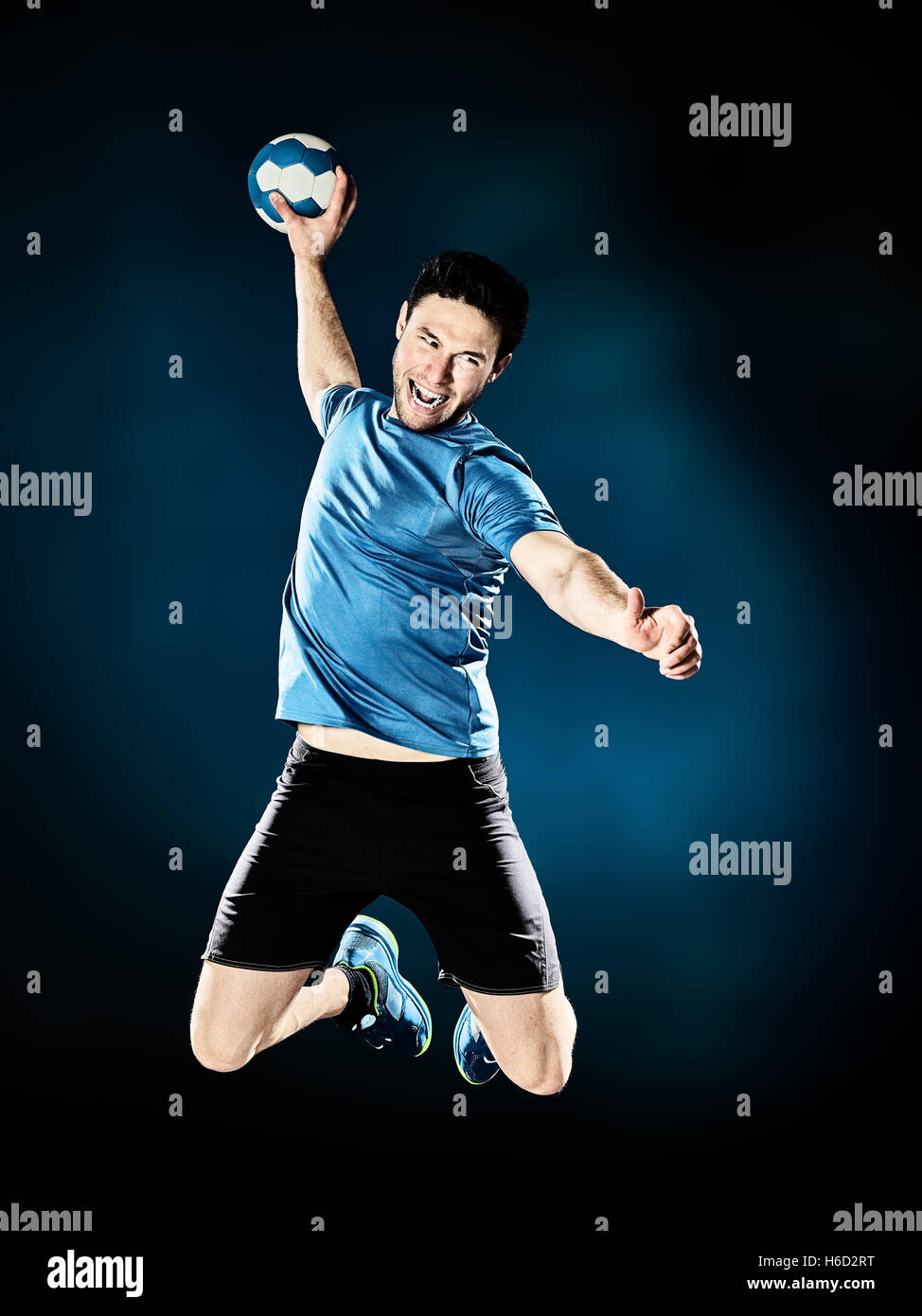one caucasian man handball player isolated on black background Stock ...