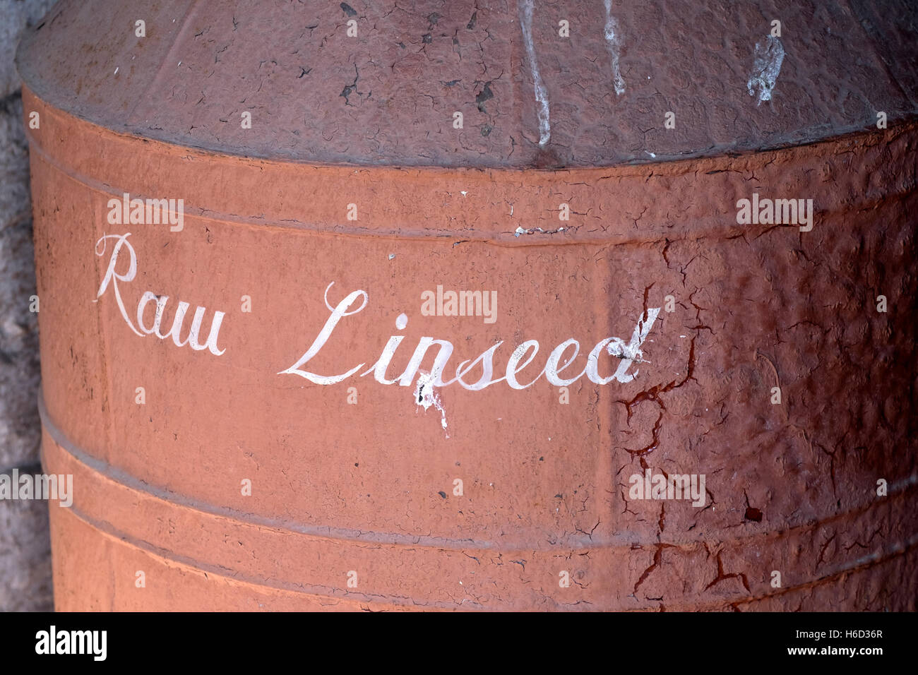 Raw Linseed container Stock Photo - Alamy