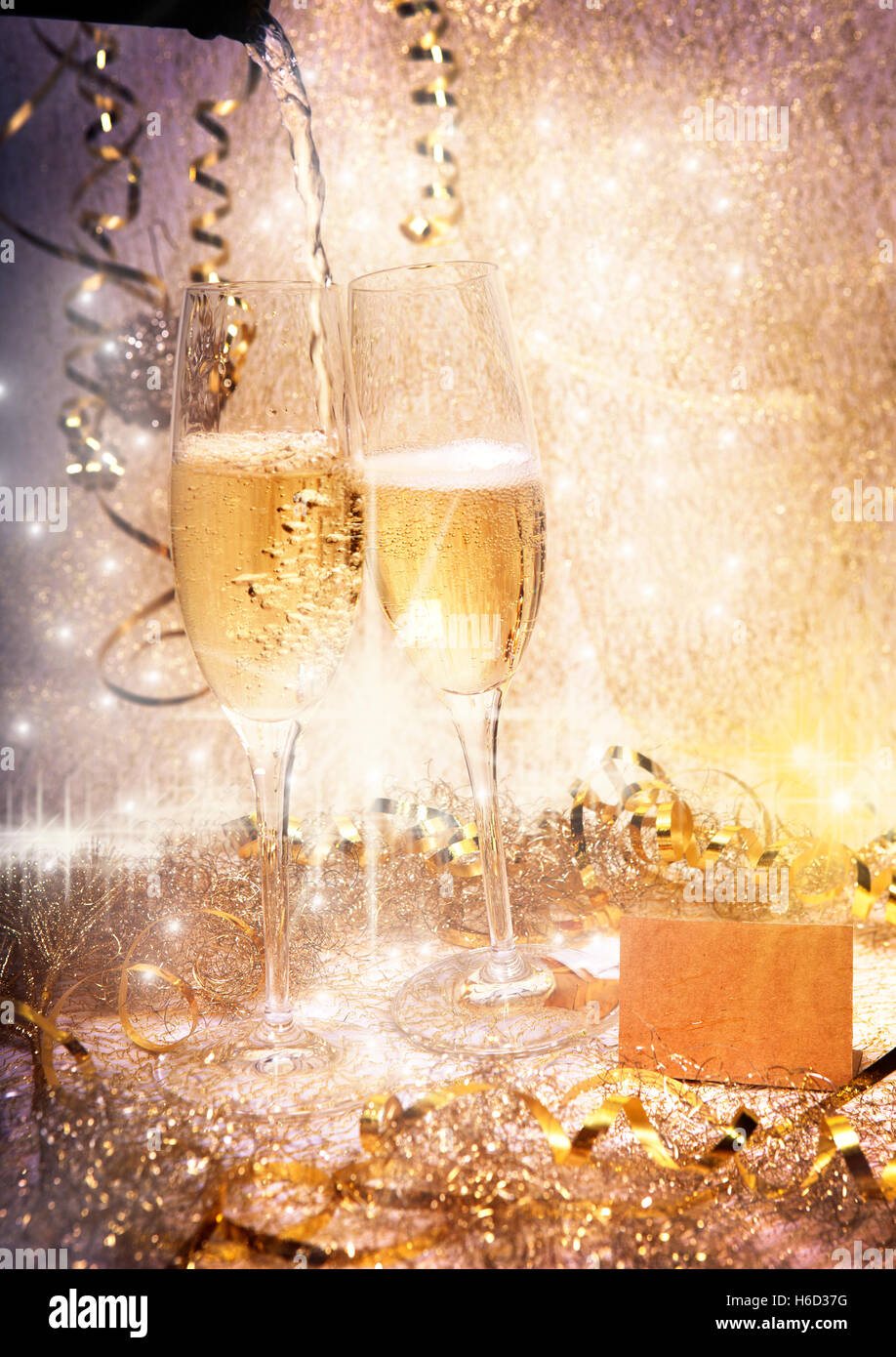 With champagne glasses is thrown on a party, background golden Stock ...