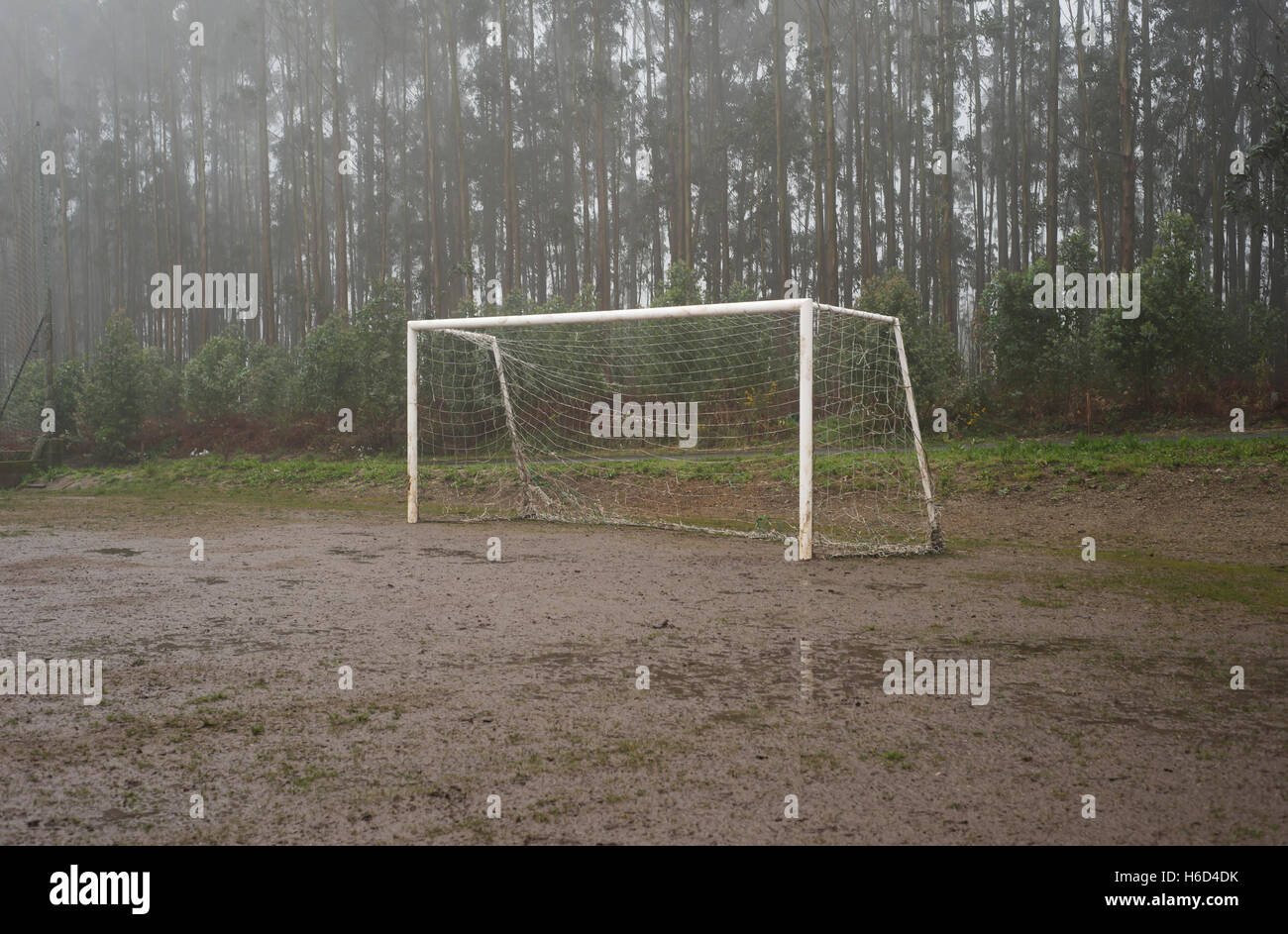 Muddy soccer field in the middle of a winter storm Stock Photo - Alamy