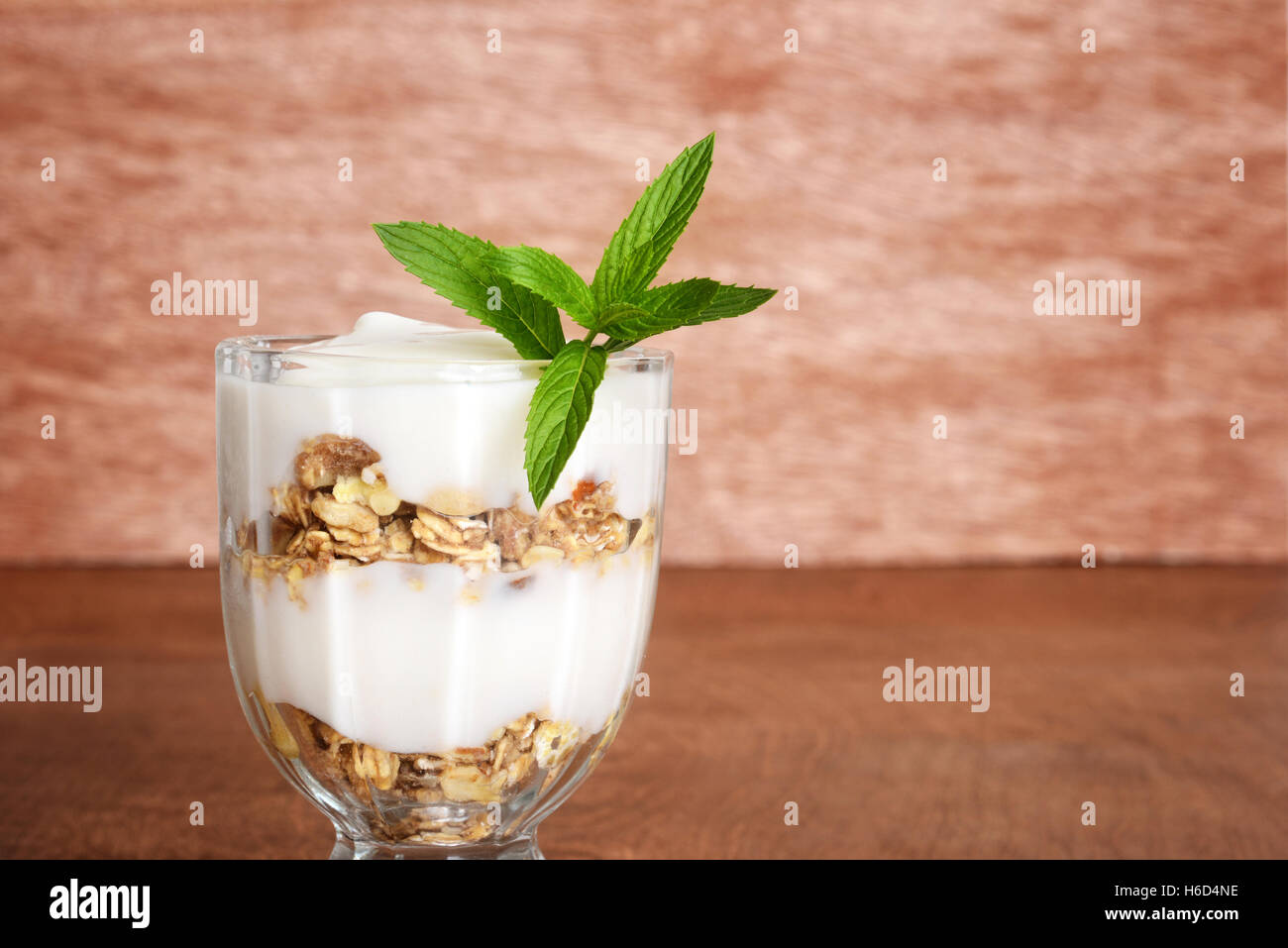 closeup vanilla parfait with granola and mint Stock Photo - Alamy