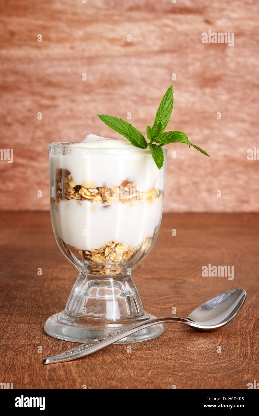 vanilla parfait with granola and mint Stock Photo - Alamy