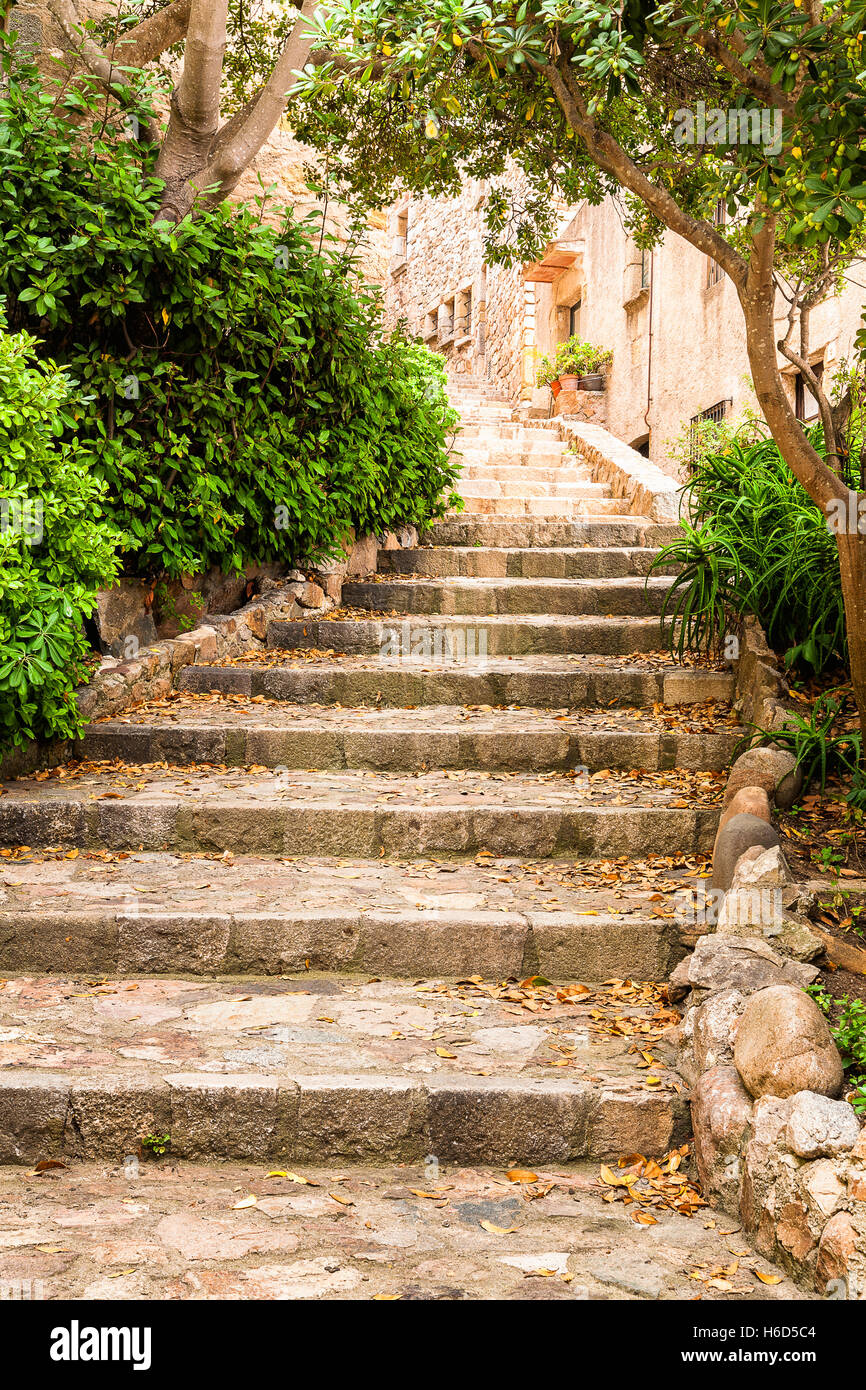 Stairs in S-curve shape in old historic street of Tossa de Mar, Costa ...
