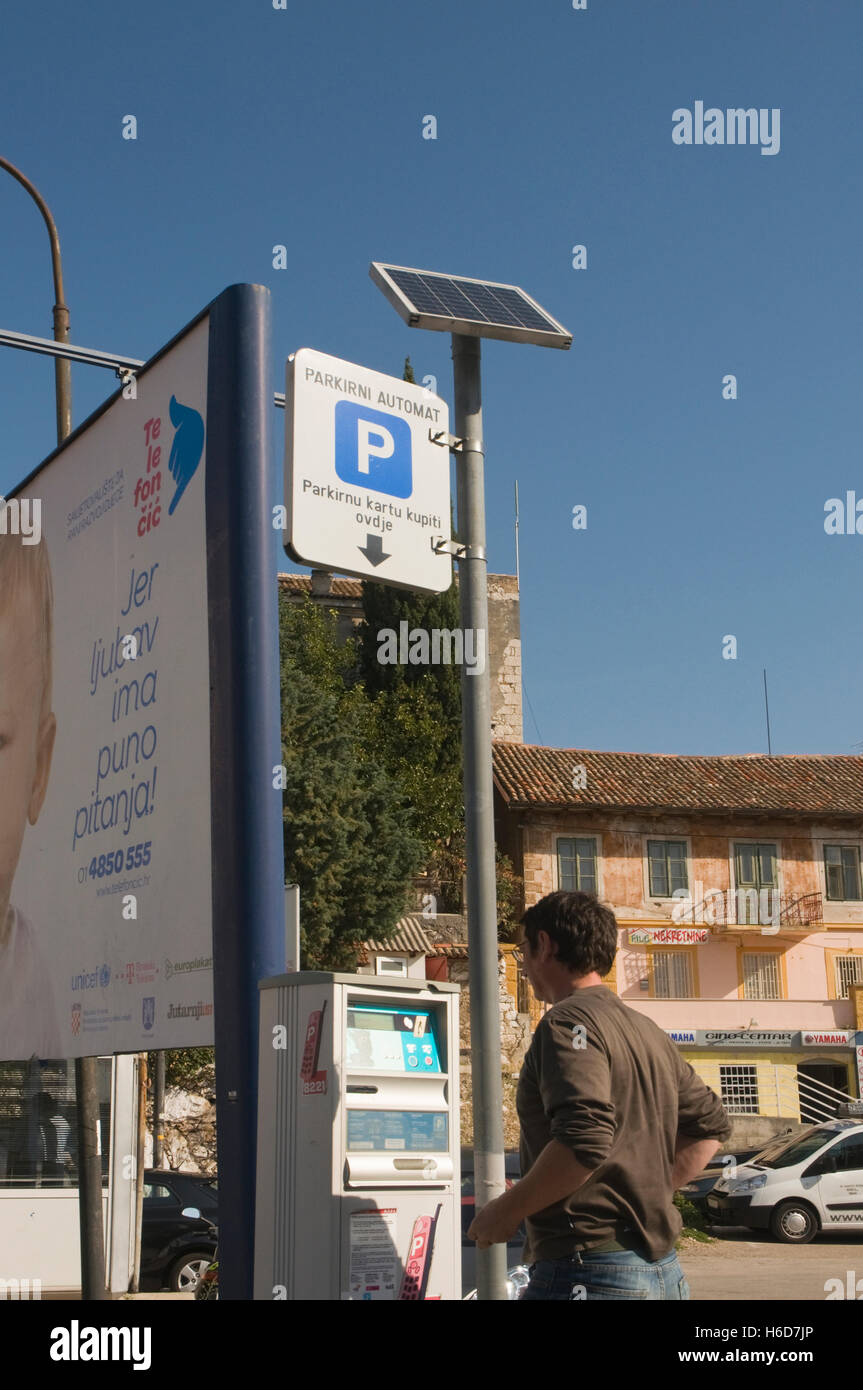 EUROPE, Croatia, Sibenik (Šibenik), man using solar powered parking ...