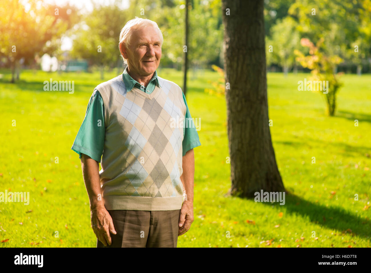 Senior man standing outdoor Stock Photo - Alamy