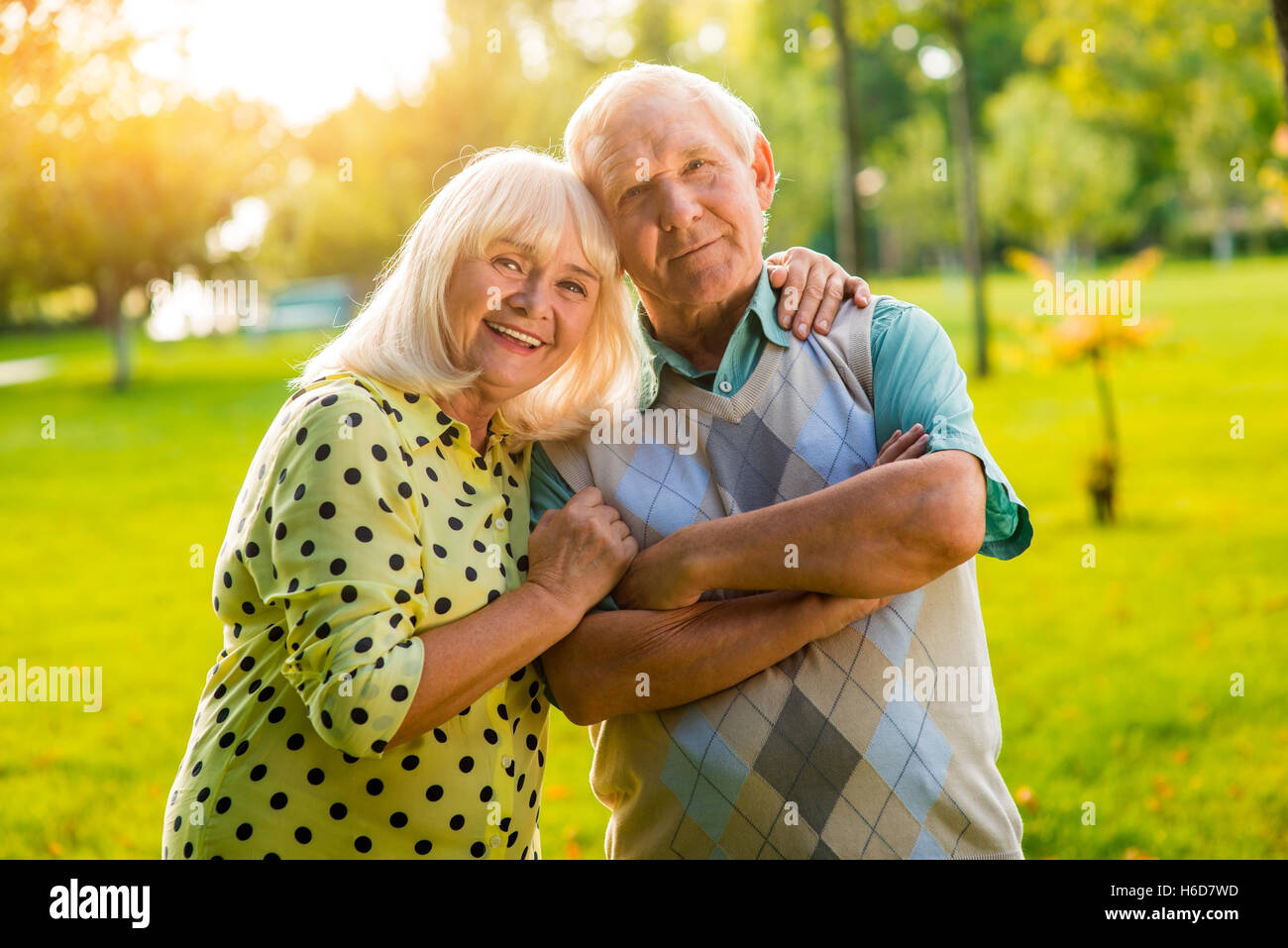 Senior woman hugs man Stock Photo - Alamy