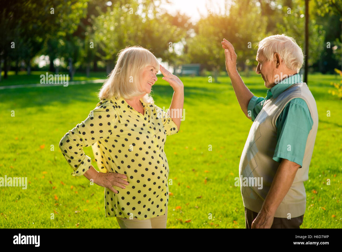 Couple giving five Stock Photo - Alamy