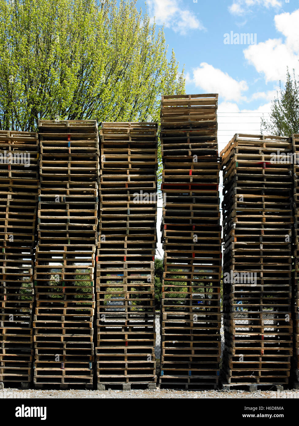 Vertical image hundreds of pallets stacked in an outside lot Stock ...