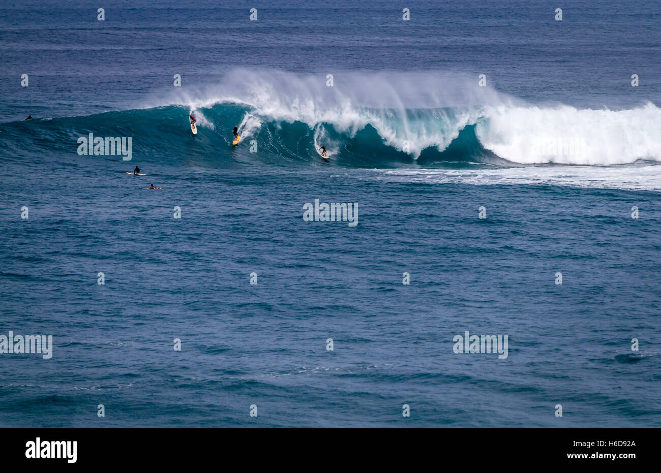 Surfing waves at Waimea Bay on the north shore of Oahu Hawaii USA April ...