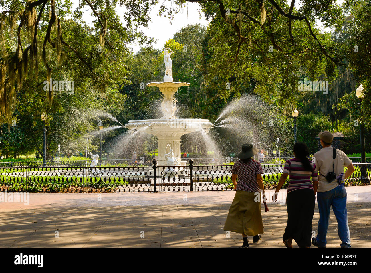 People stroll towards the landmark fountain in Forsyth Park in historic ...
