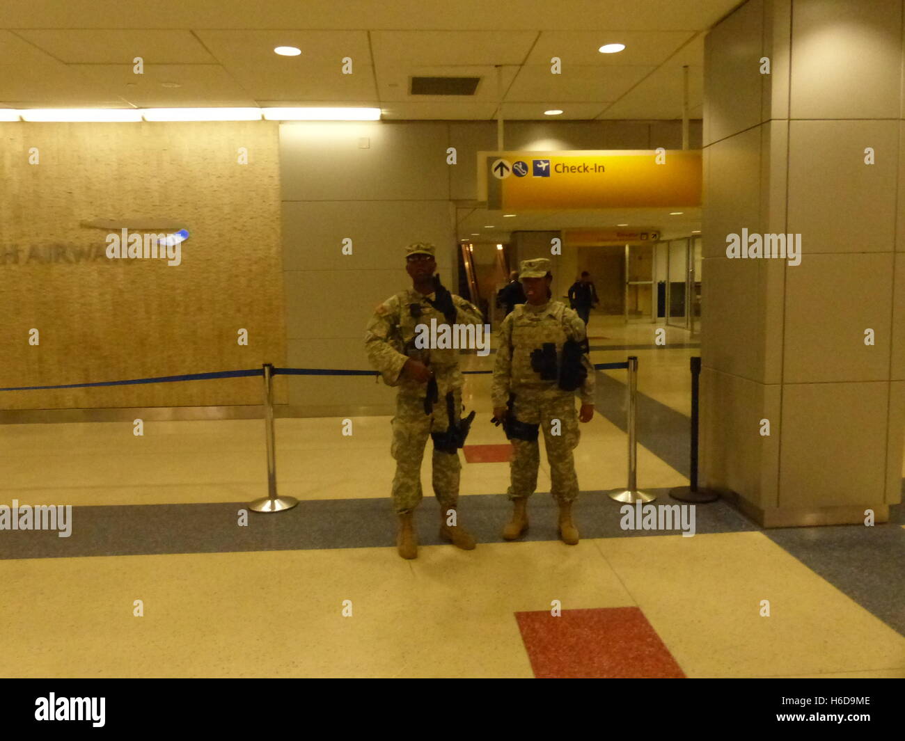 Armed US Marine Corps Anti Terrorism Unit patrol British Airways ...