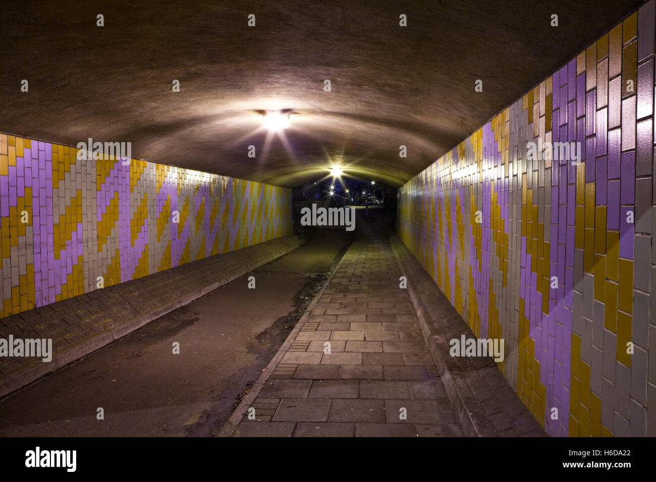 A night-time view of an eerie urban underpass or tunnel Stock Photo - Alamy