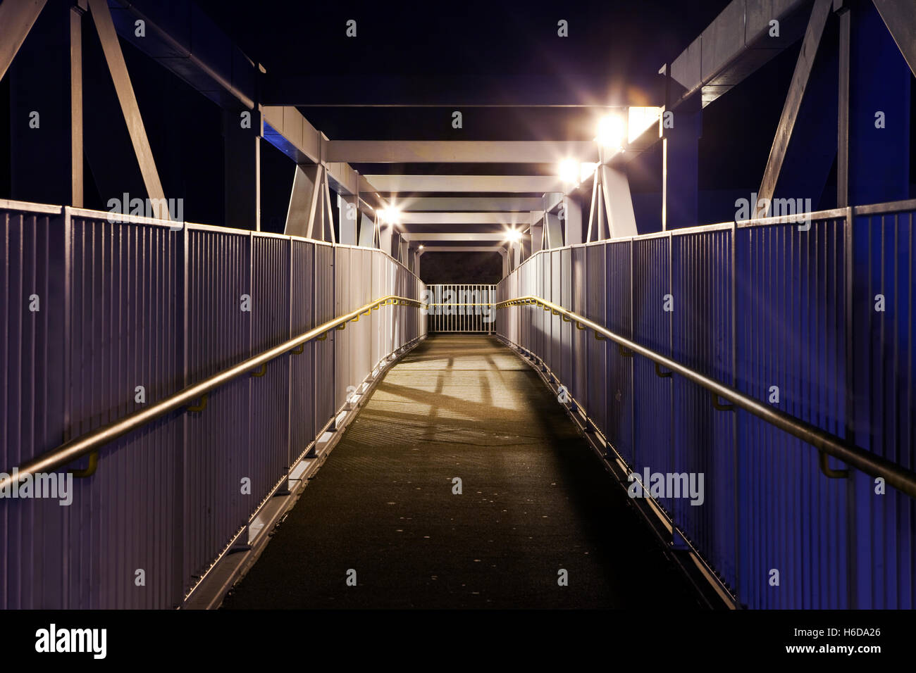 A night-time view of an eerie urban foot bridge Stock Photo - Alamy