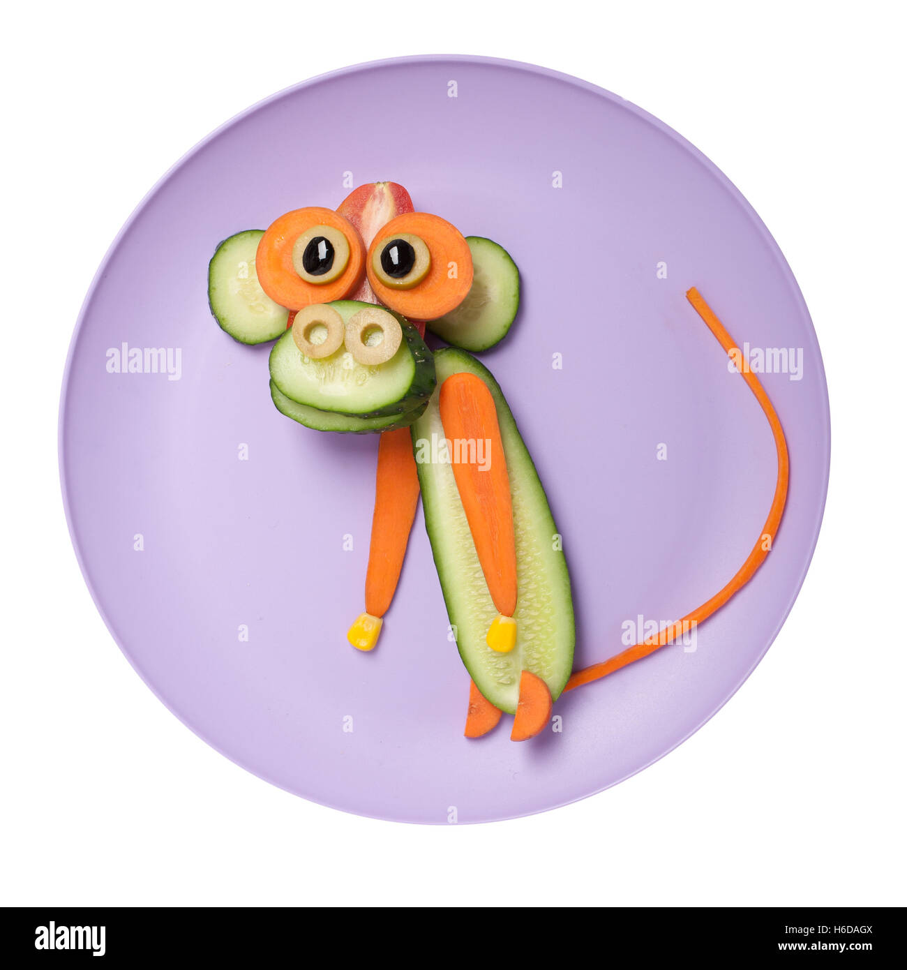 Funny monkey made of cucumber and carrot on plate Stock Photo - Alamy