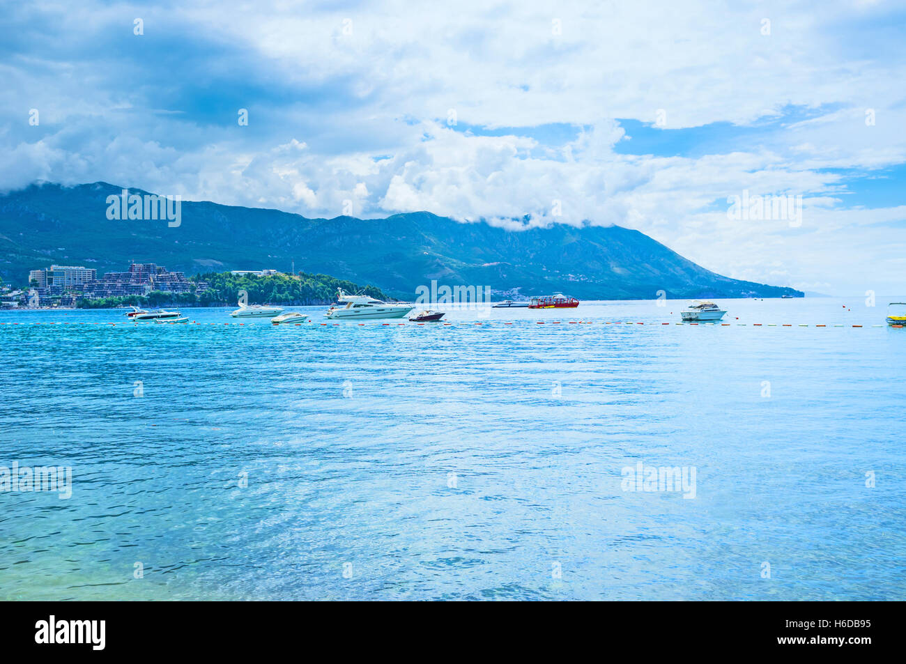 The coastline of the Budva riviera with the tourist boats and vilages ...