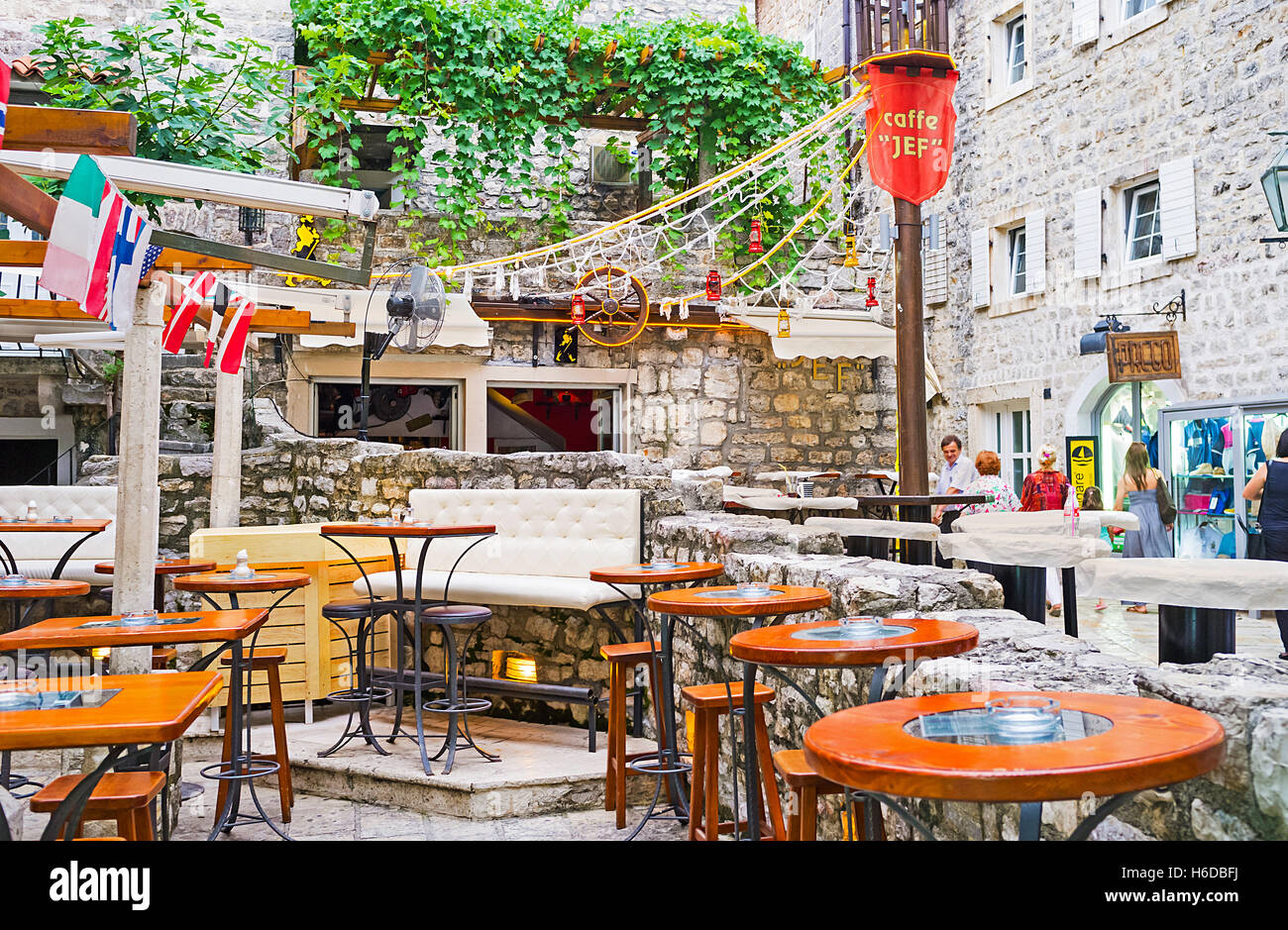 The street bar in old town, decorated with the mast, ropes and flags ...