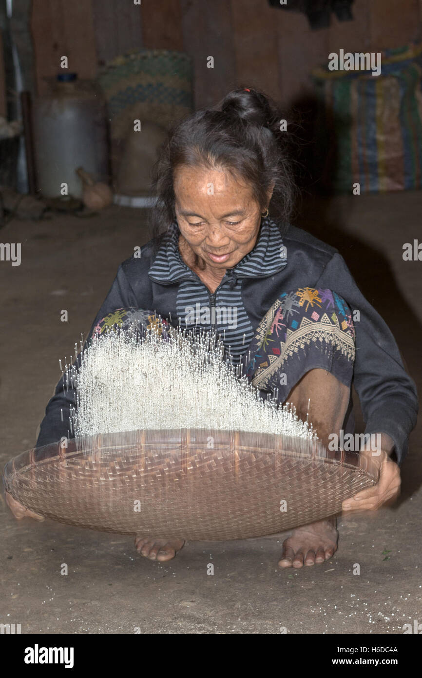 Woman sieving rice hi-res stock photography and images - Alamy