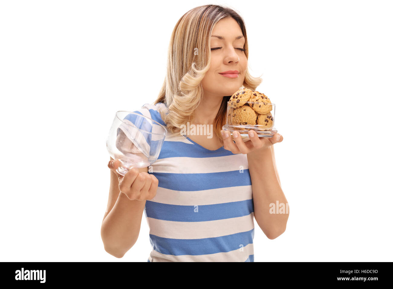 Woman smelling cookies in a jar isolated on white background Stock ...