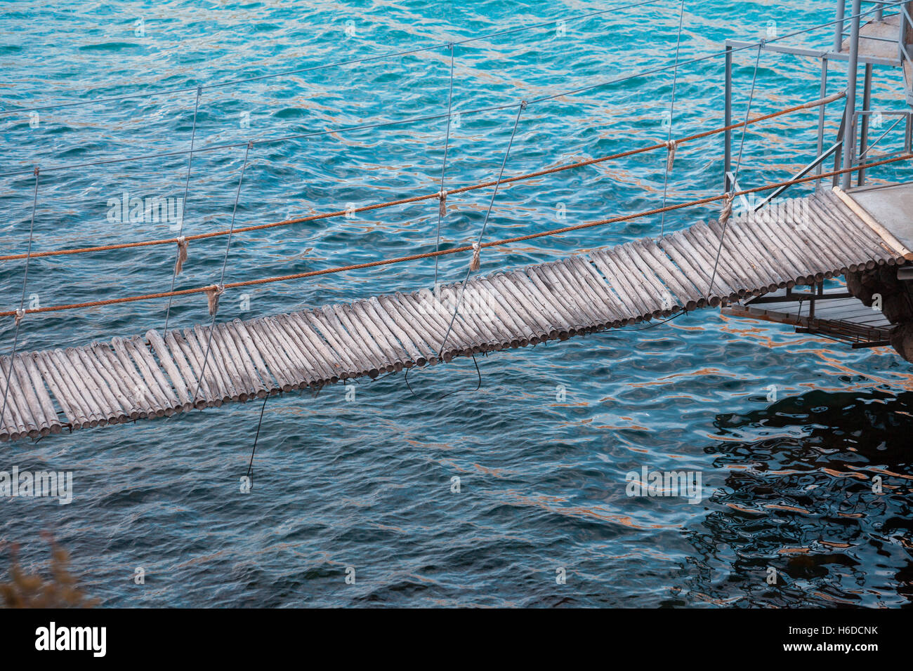 hanging wooden bridge over lake Stock Photo - Alamy