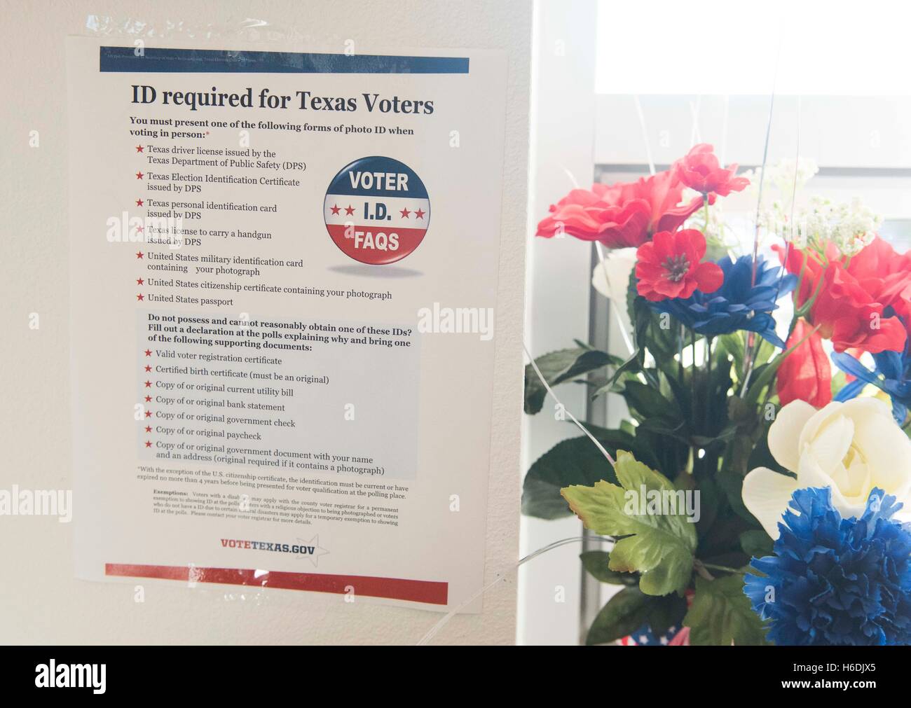 A poster lists voter ID requirements at an early voting location in the ...
