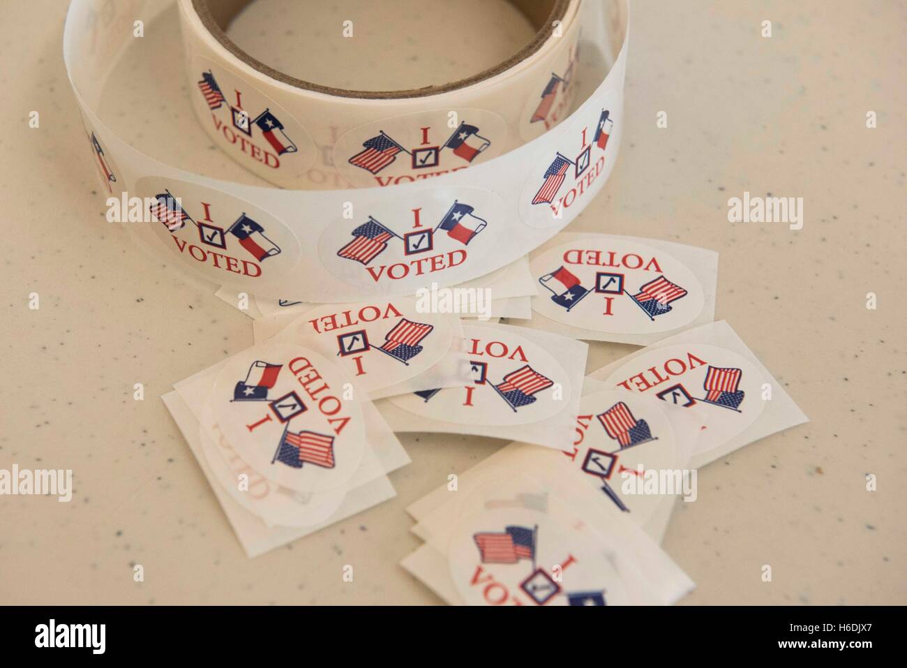A roll of "I voted" stickers await early voters at a polling station in ...