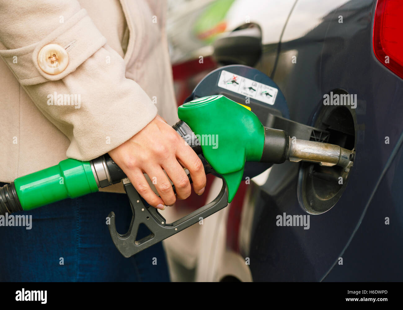 Closeup woman pouring oil hi-res stock photography and images - Alamy