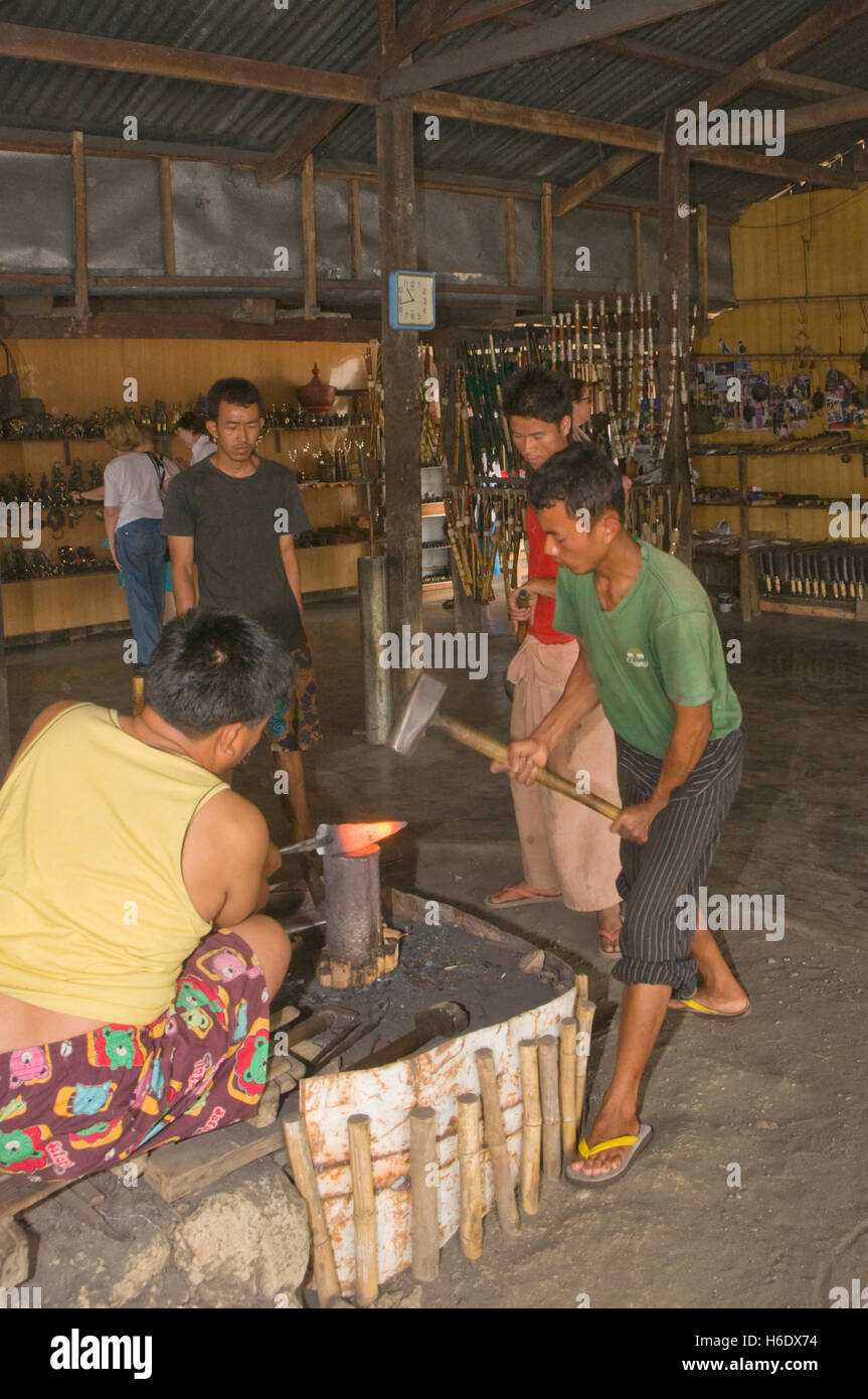 ASIA, MYANMAR (BURMA), Lake Inle, In Phaw Khone, men at work in a ...