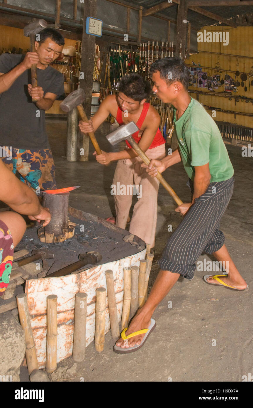 ASIA, MYANMAR (BURMA), Lake Inle, In Phaw Khone, men at work in a ...
