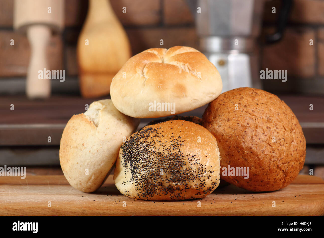 Assortment of bread rolls at rural kitchen background Stock Photo - Alamy