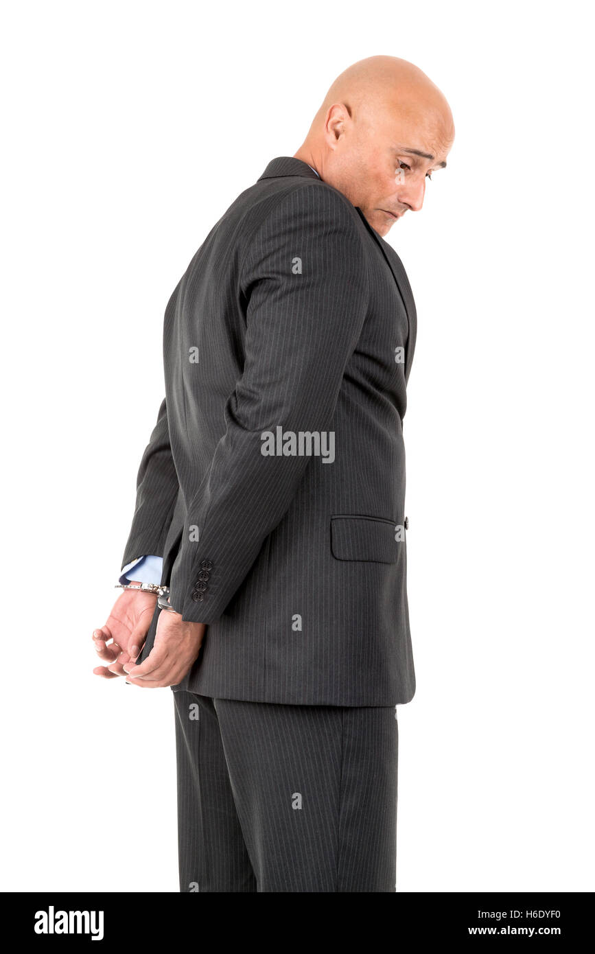 Businessman in handcuffs isolated in white background Stock Photo - Alamy
