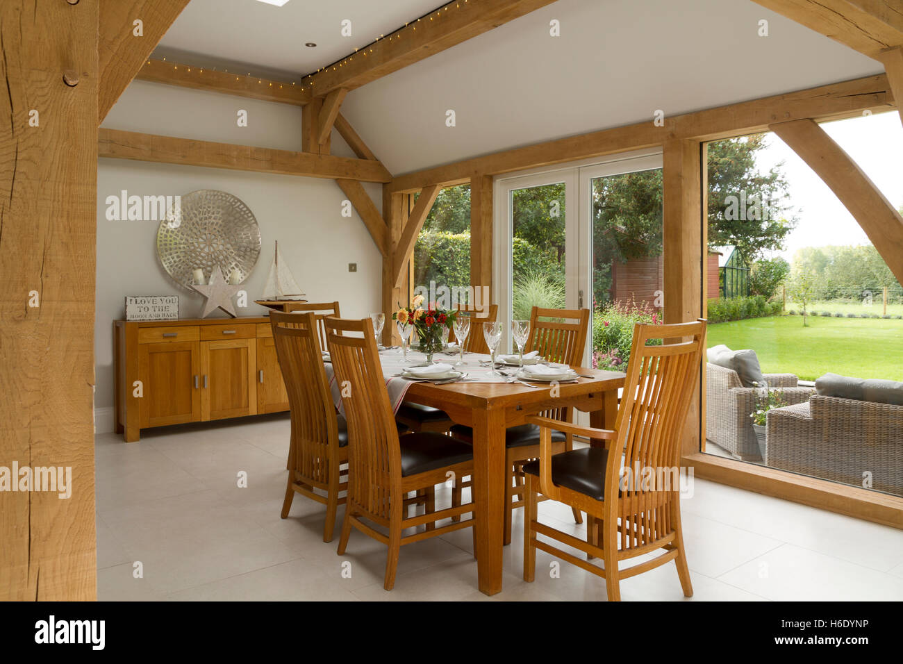 Rear of house green oak extension Stock Photo - Alamy