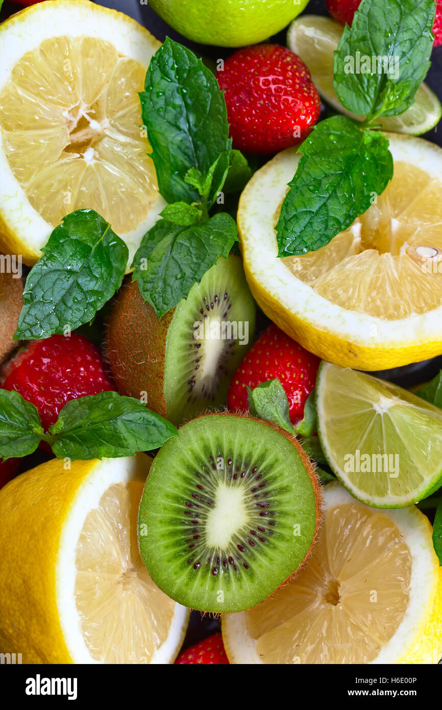 The ripe juicy fruits and peppermint leaves Stock Photo - Alamy