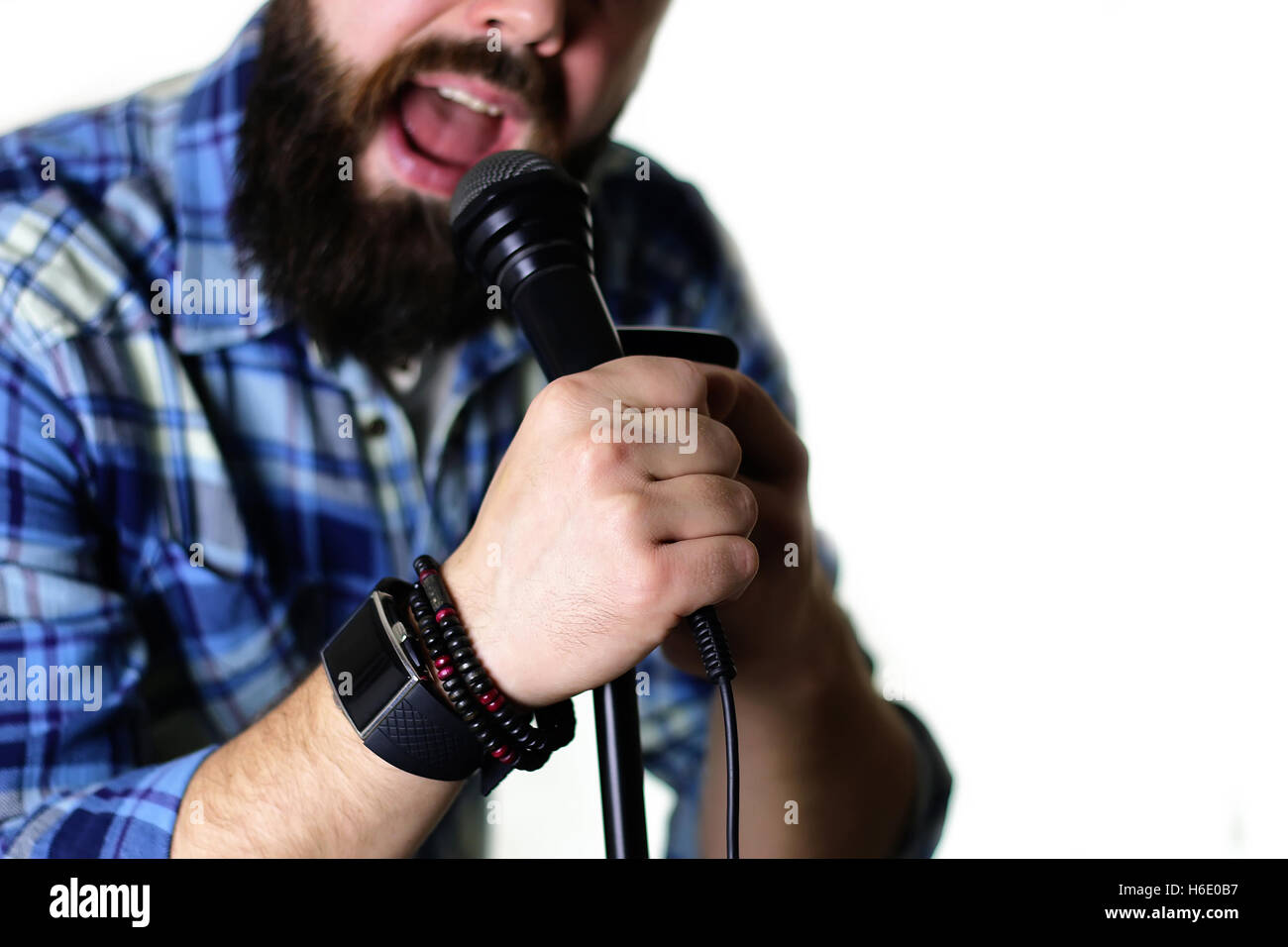 microphone on stage hand hold Stock Photo - Alamy