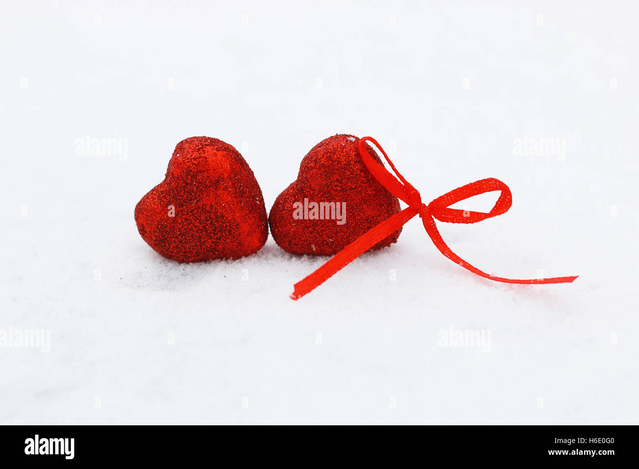 Snow hearts red winter two Stock Photo - Alamy