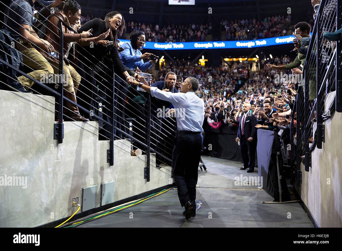 U.S. President Barack Obama shakes hands with crowd members on his way ...