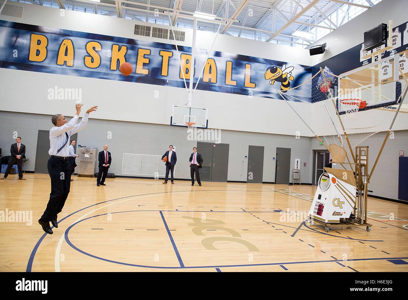 U.S. President Barack Obama shoots basketballs at a Georgia Tech court ...