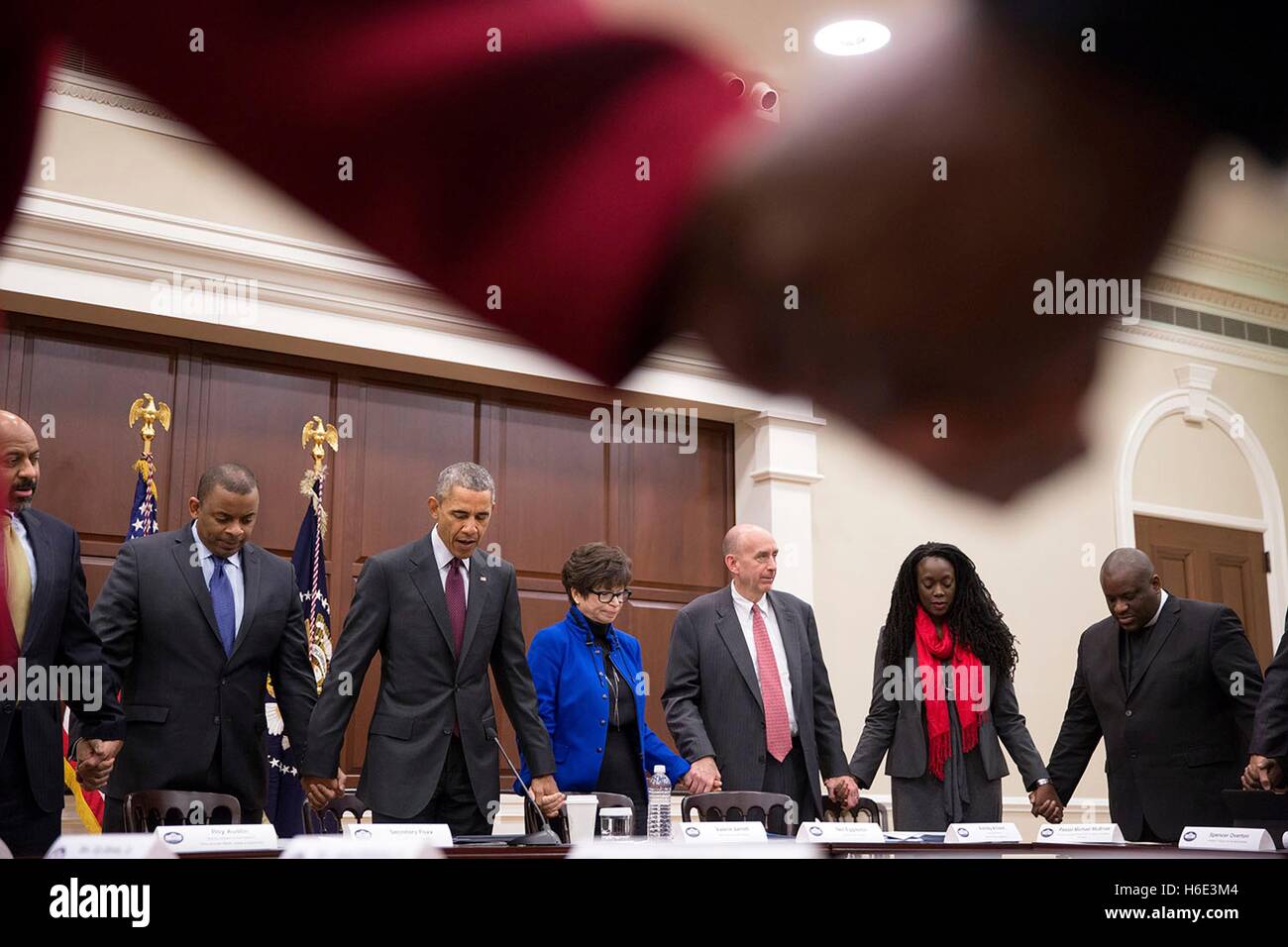U.S. President Barack Obama joins hands with African American faith and ...