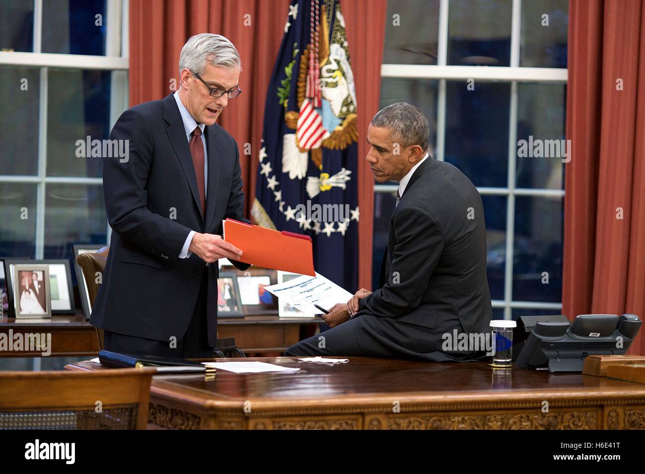 U.S. President Barack Obama confers with Chief of Staff Denis McDonough ...