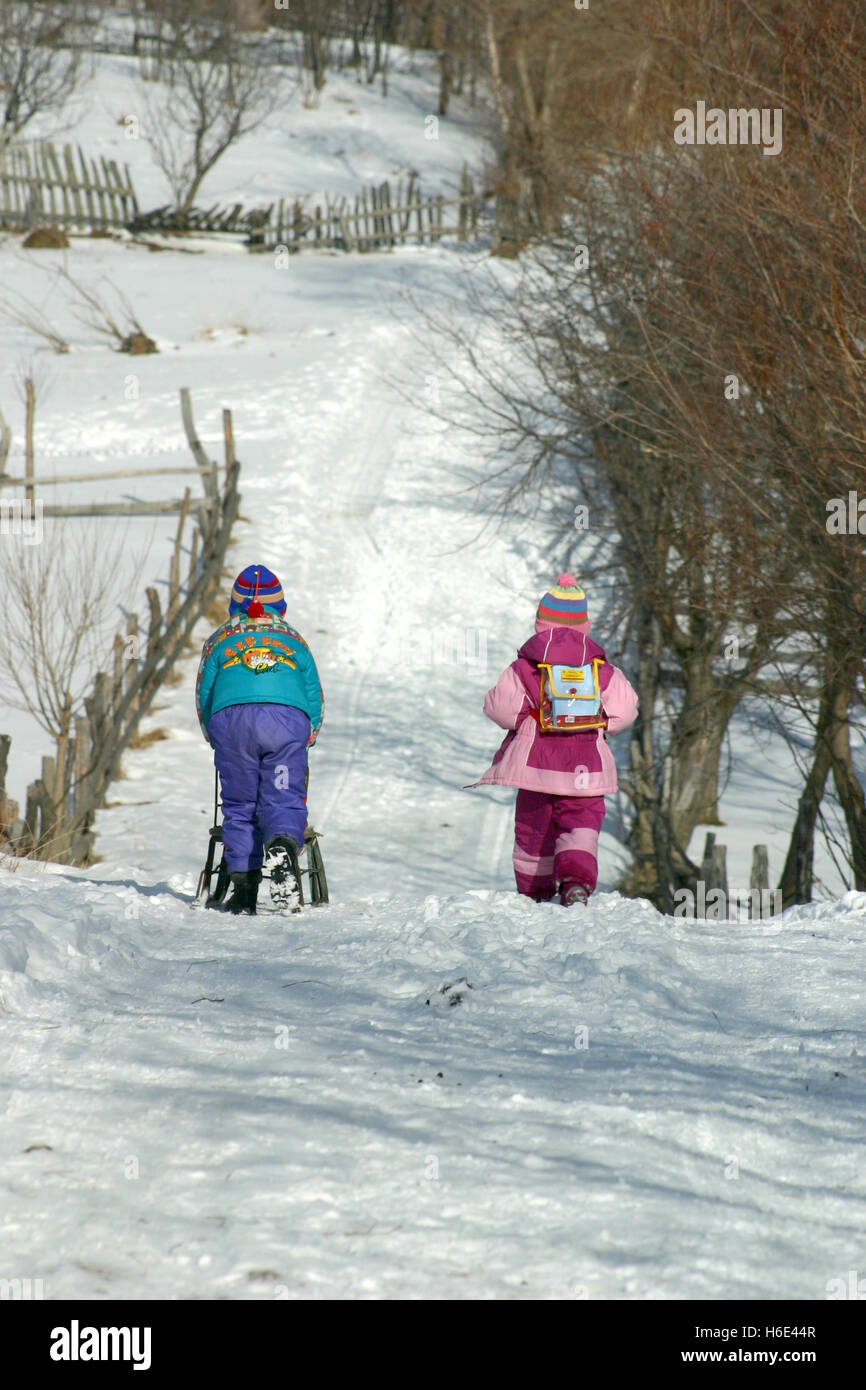 Kids on snow slide hi-res stock photography and images - Alamy