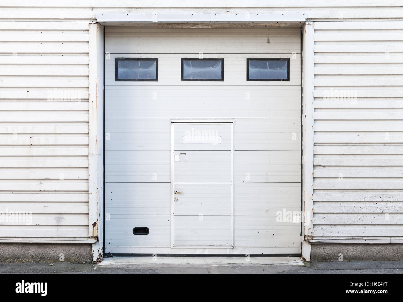 White metal warehouse wall with closed gate, flat background photo ...
