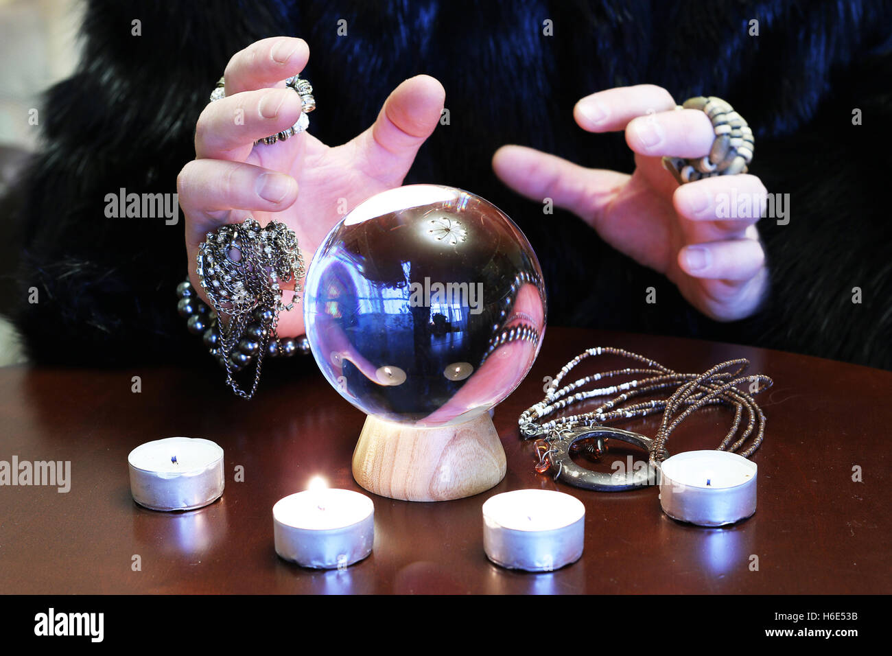 sorcerer hands over a transparent crystal ball fortune-telling for ...