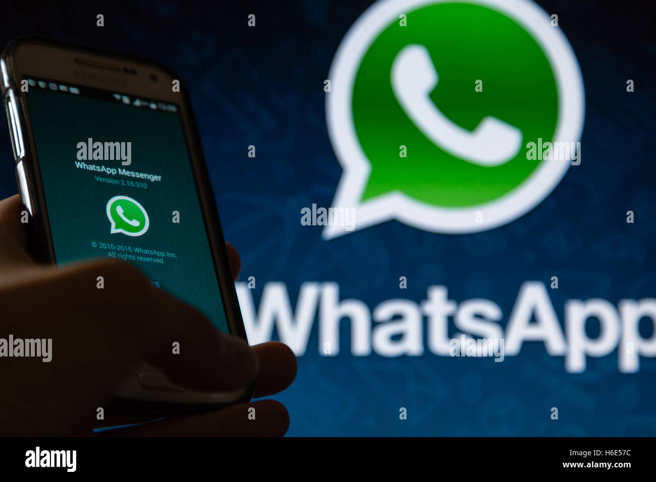 A smartphone display shows WhatsApp Messenger application Stock Photo ...