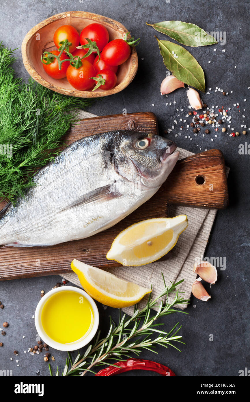 Raw fish cooking and ingredients. Dorado, lemon, herbs and spices. Top ...
