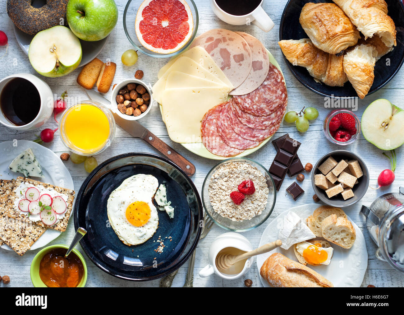 Big breakfast on the white rustic table Stock Photo - Alamy