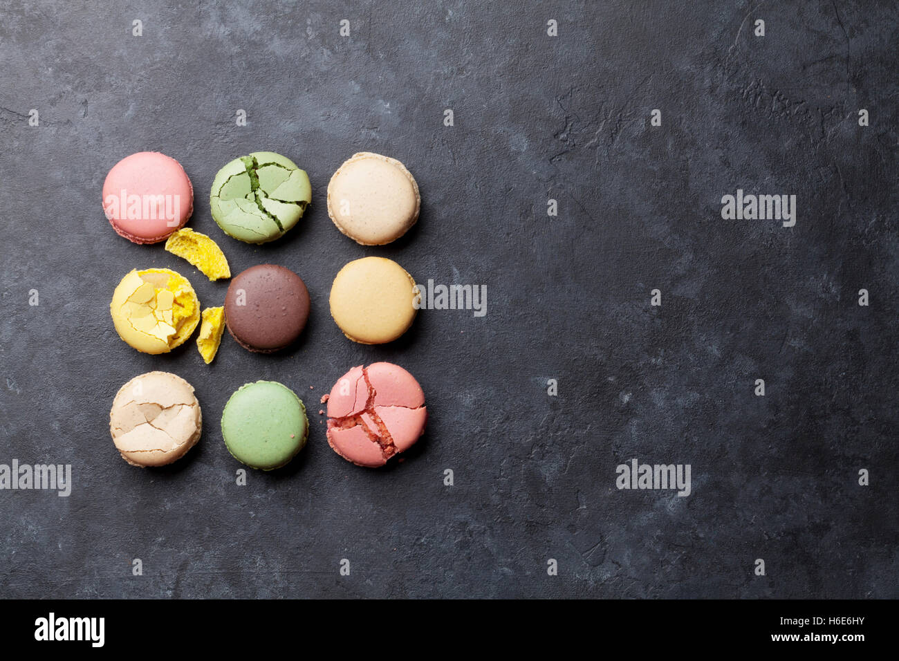 Colorful macaroons on stone table. Sweet macarons. Top view with copy ...